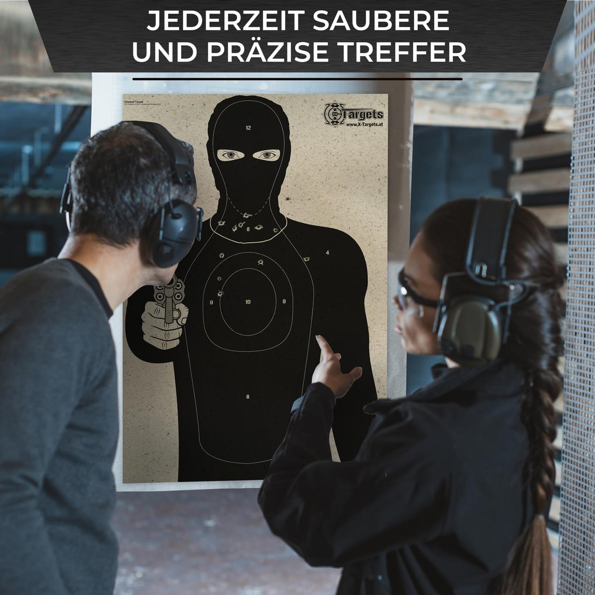 Criminal Target - Grass paper with clearly visible bullet holes and a ...